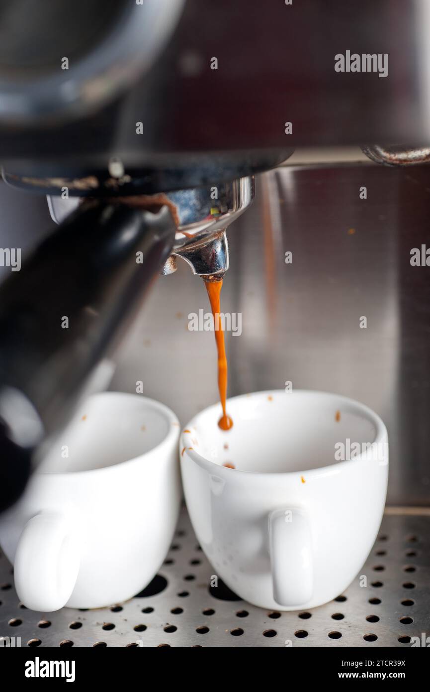 Italian espresso coffe making with professional machine macro Stock ...