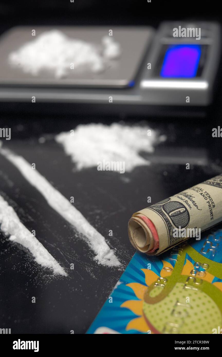 Cocaine drug powder over black abuse concept with digital scale over ...
