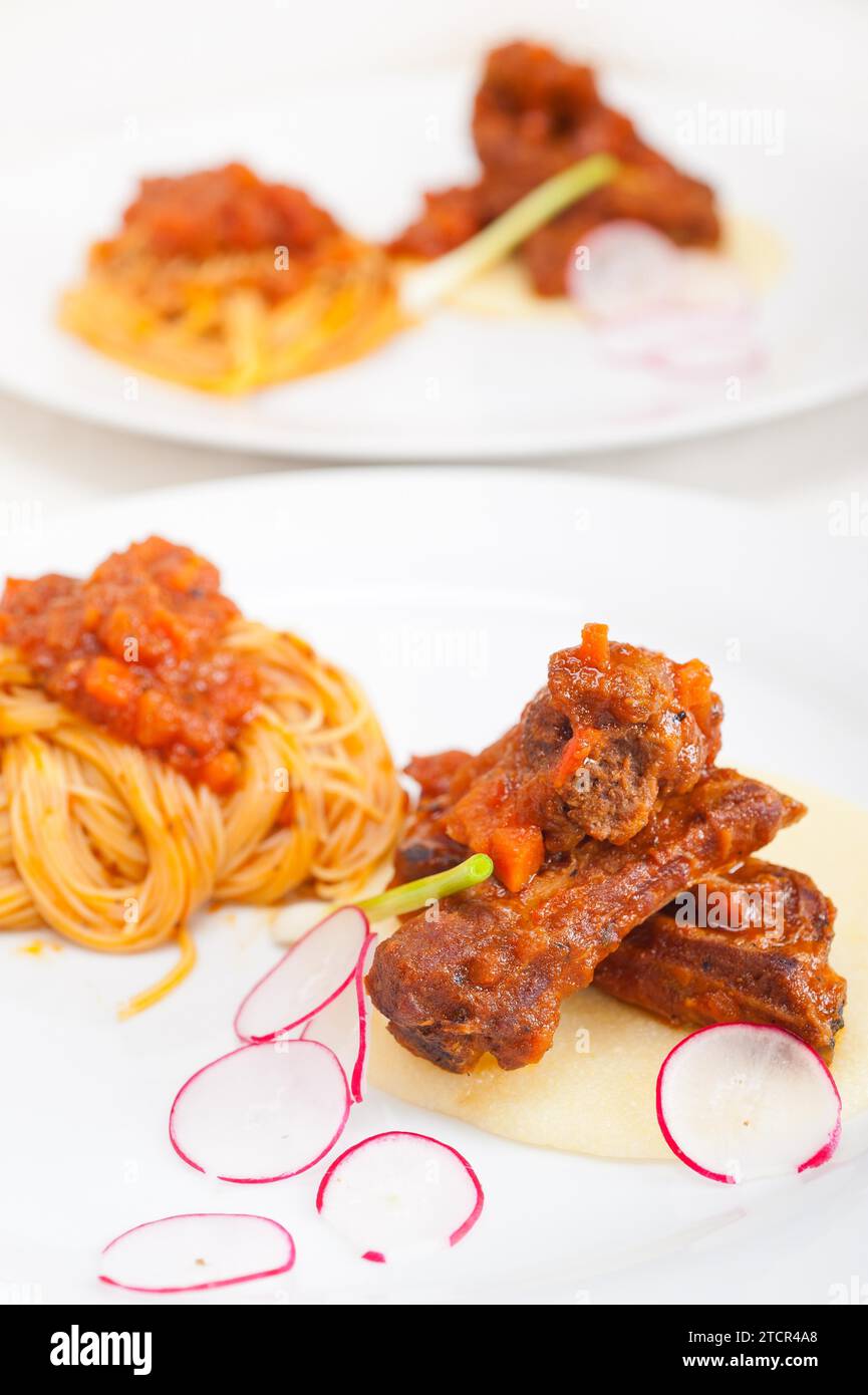 Traditional Italian spaghetti pasta with pork ribs sauce served on ...