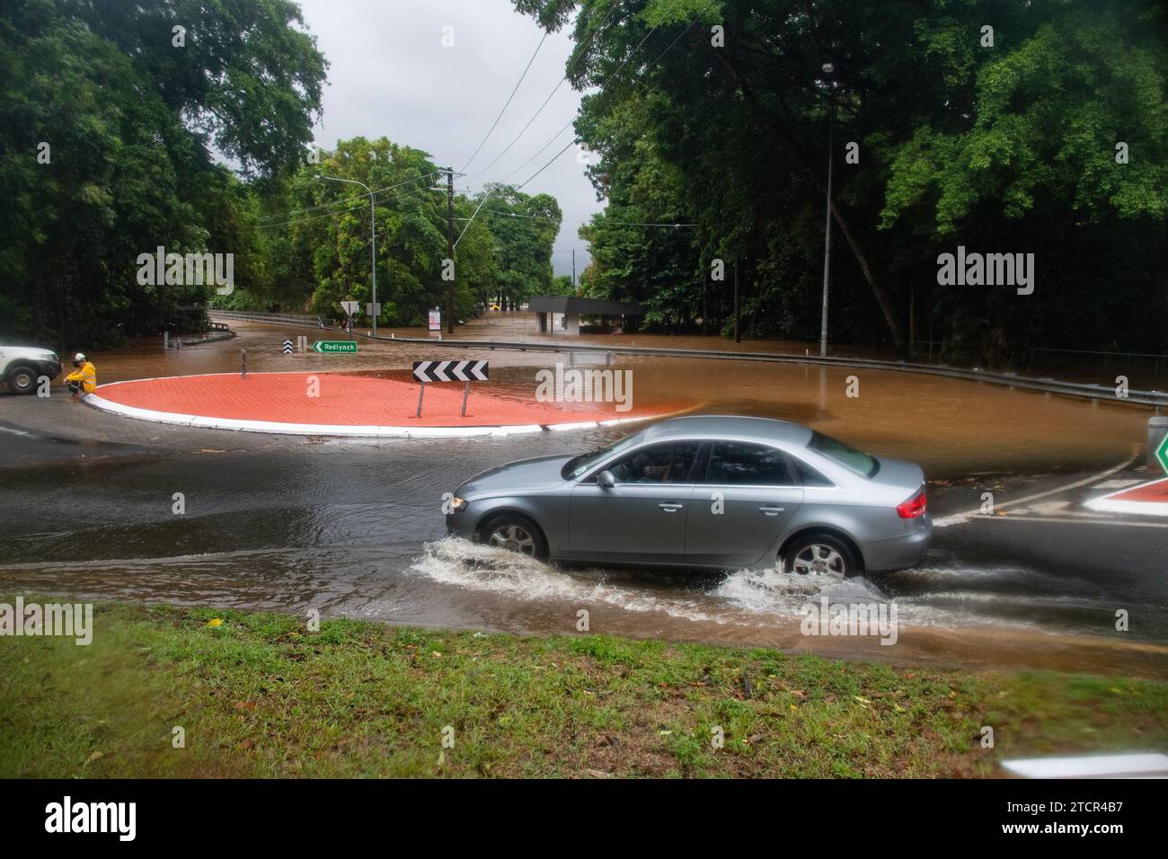 Cairns, Australia. 14th Dec, 2023. A motorist drives through flood ...