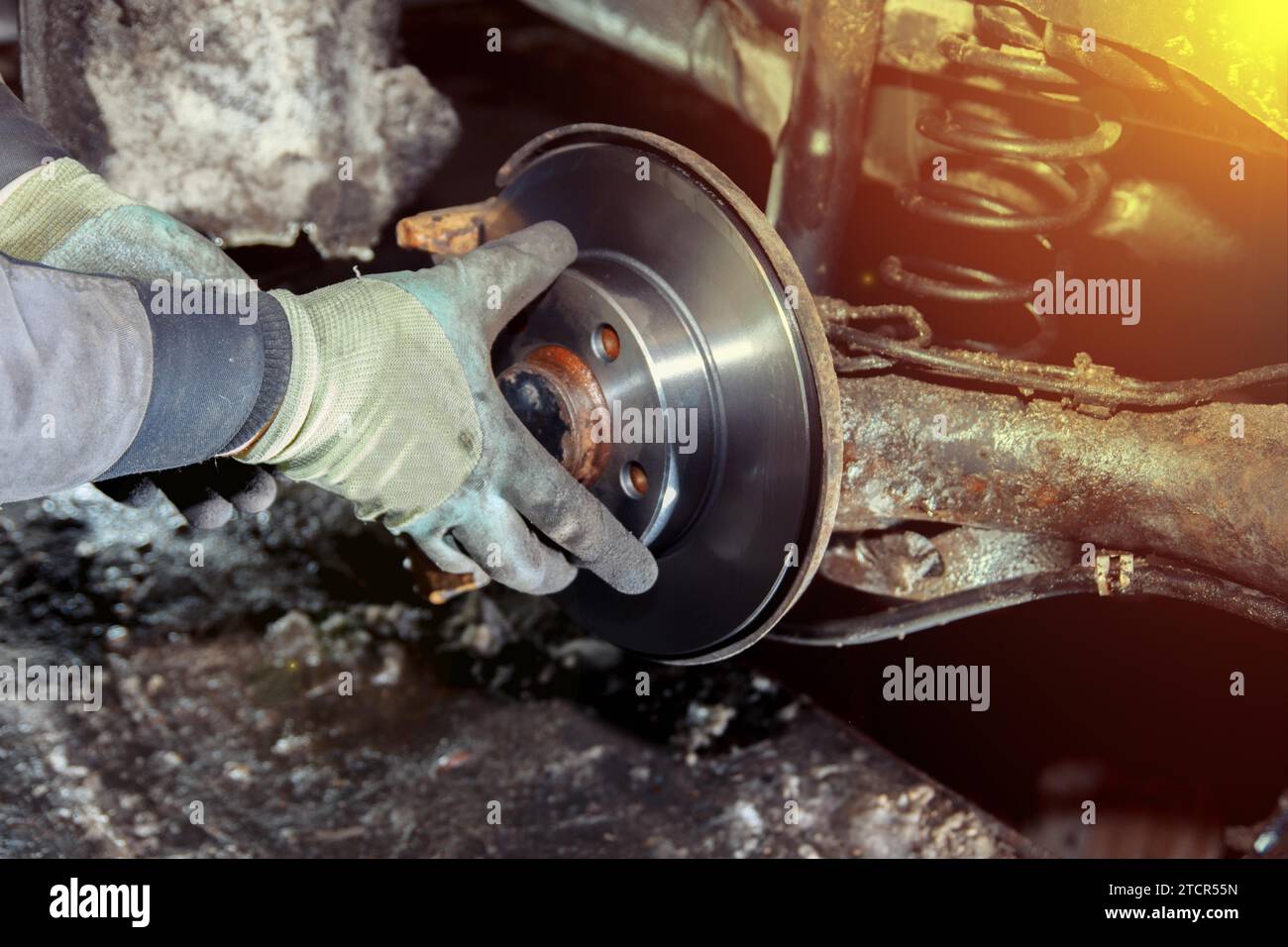 Installing a new car brake disc Stock Photo - Alamy