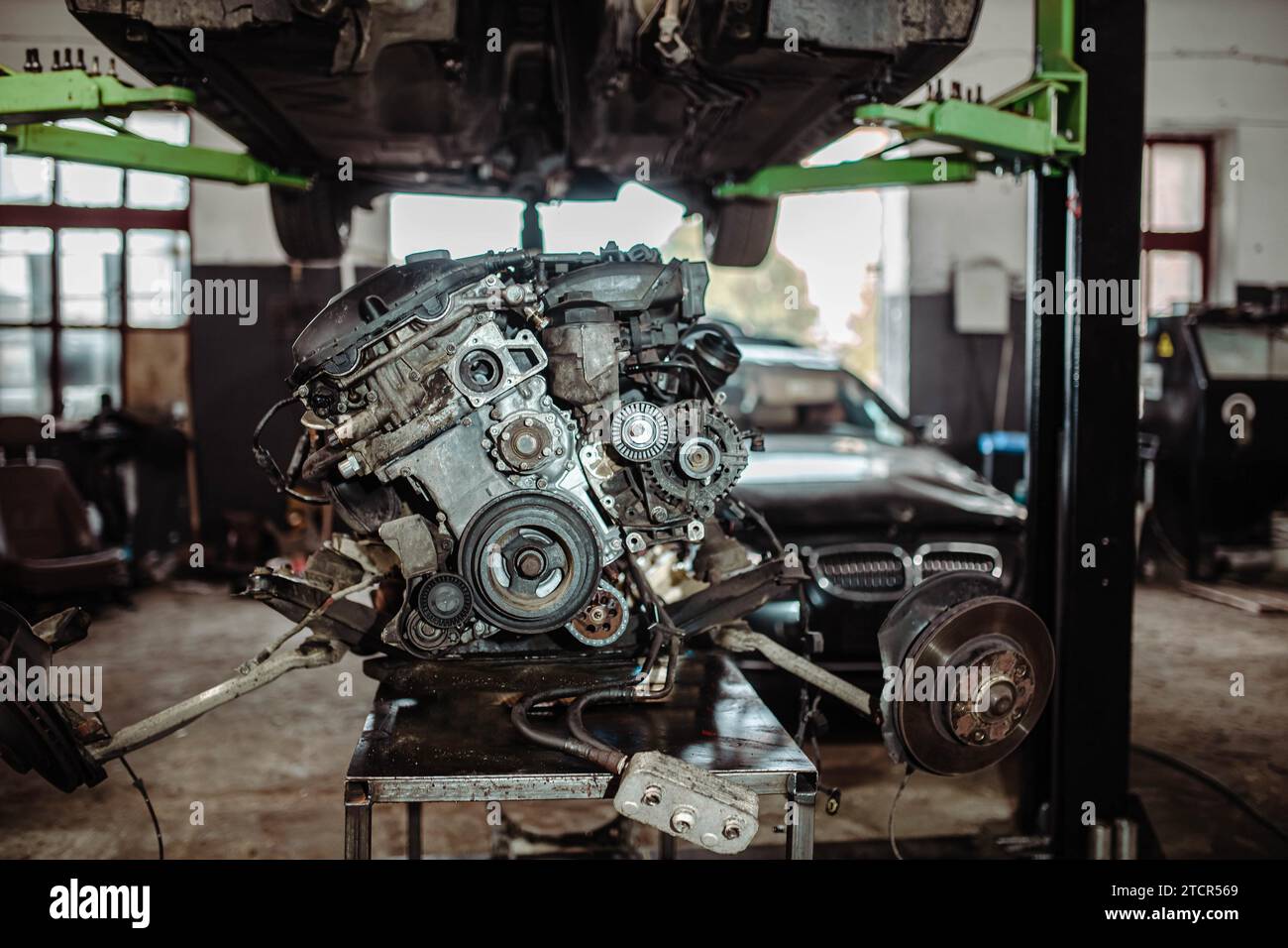 Removed car engine, engine repair process Stock Photo - Alamy
