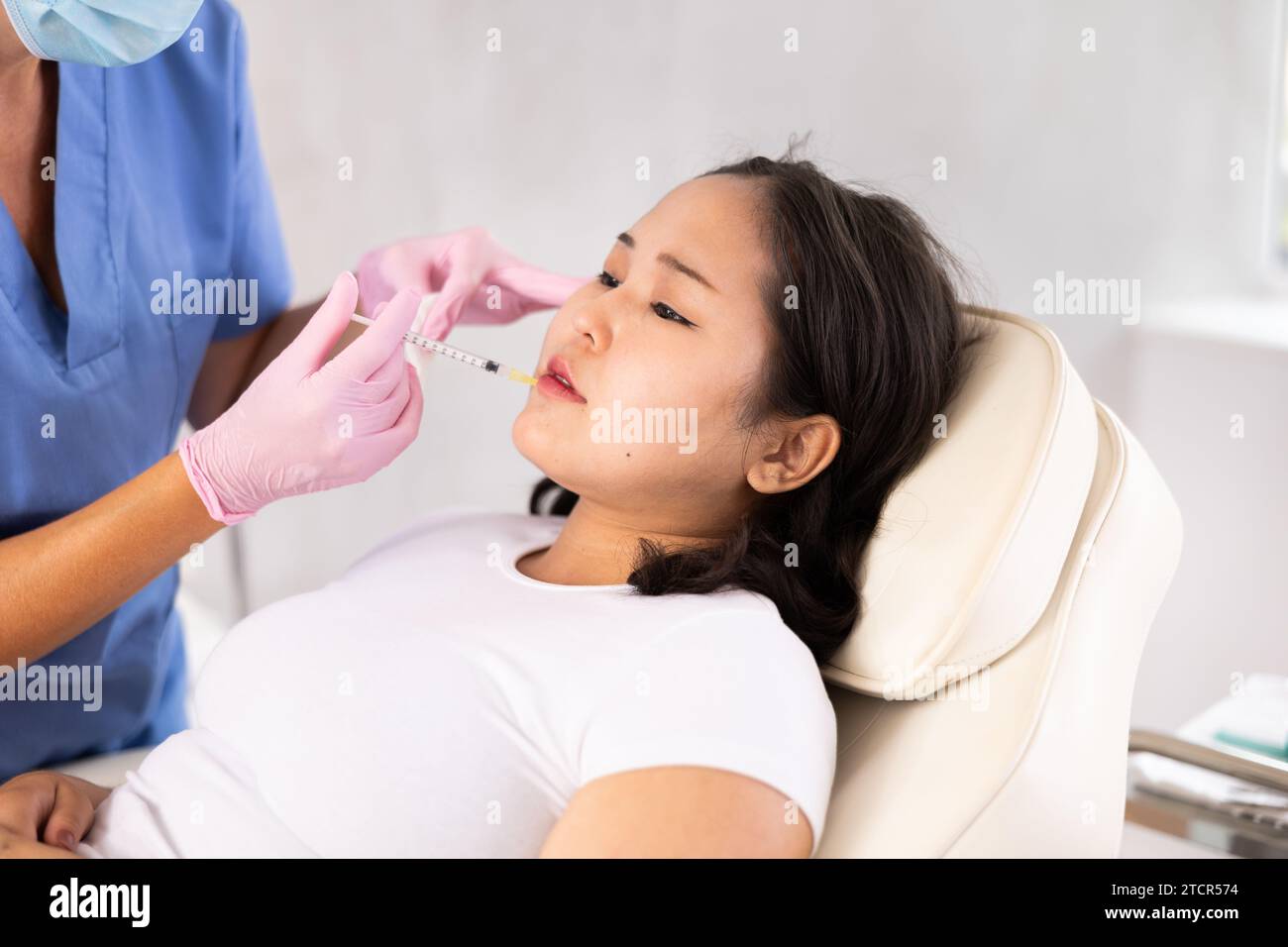 Specialist making injections mesotherapy client hi-res stock ...