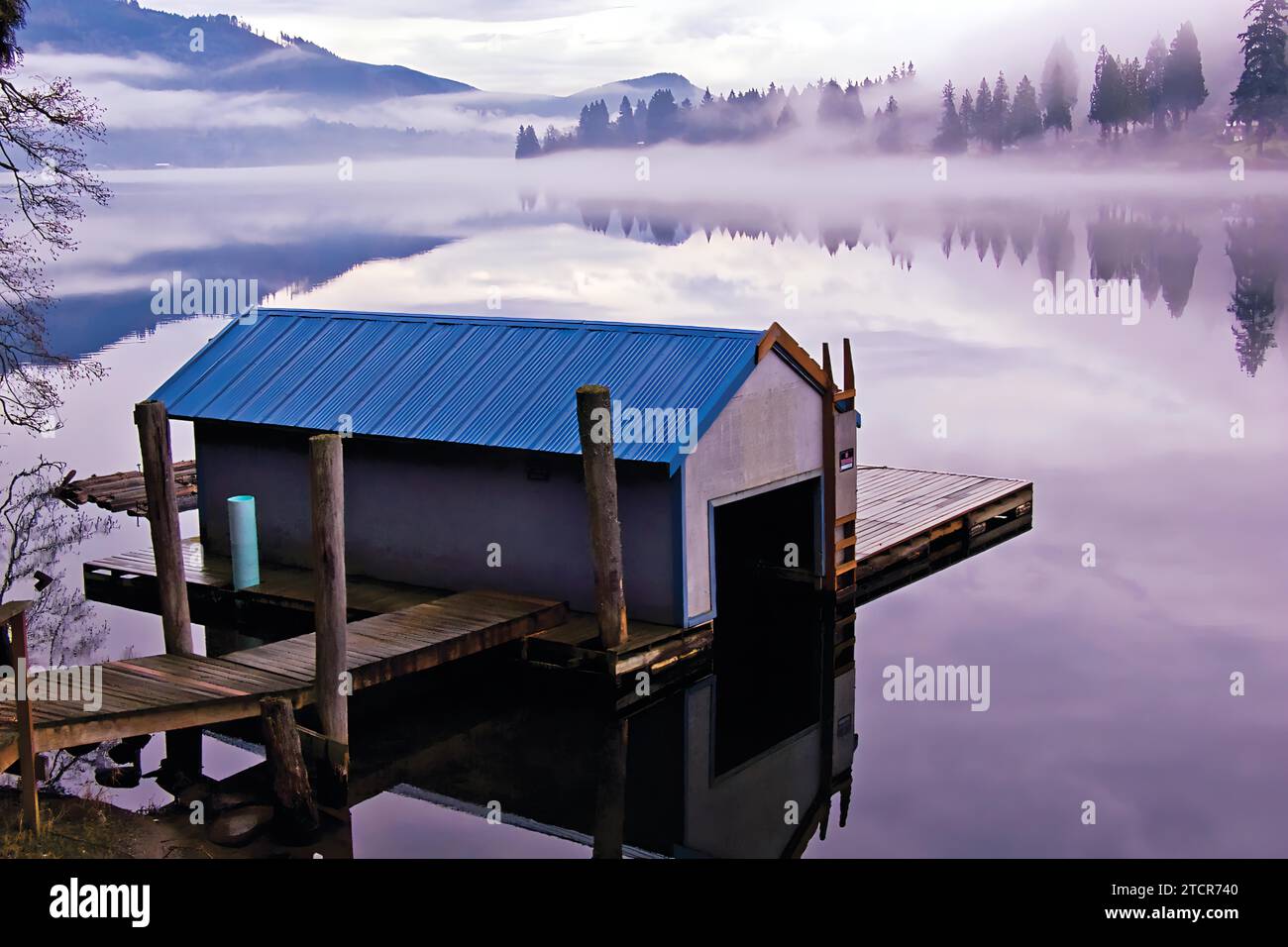 A scenic view of a wooden boat house at Lake Samish, Washington State ...