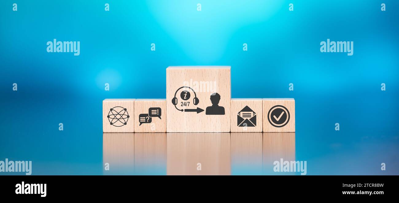 Wooden blocks with symbol of customer service concept on blue ...