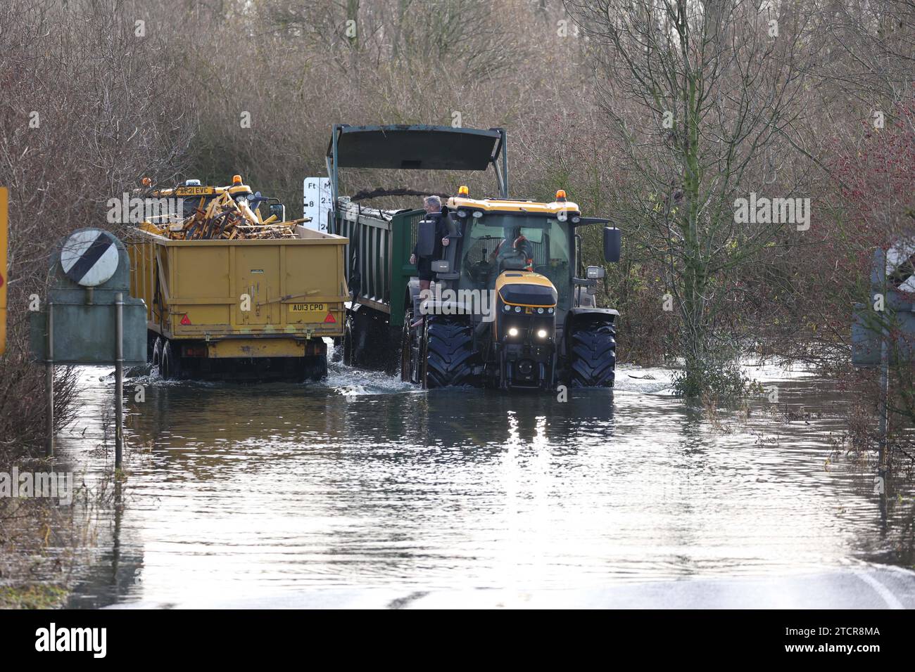 Welney, UK. 12th Dec, 2023. the road as the Welney wash fills with ...