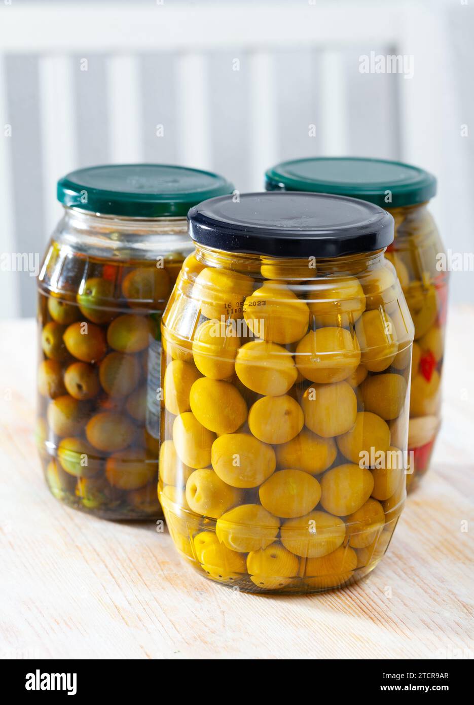 Pickled olives in a jar Stock Photo - Alamy