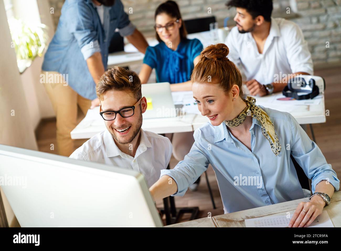 Programmers working in a software developing company office. Business people as a team Stock ...