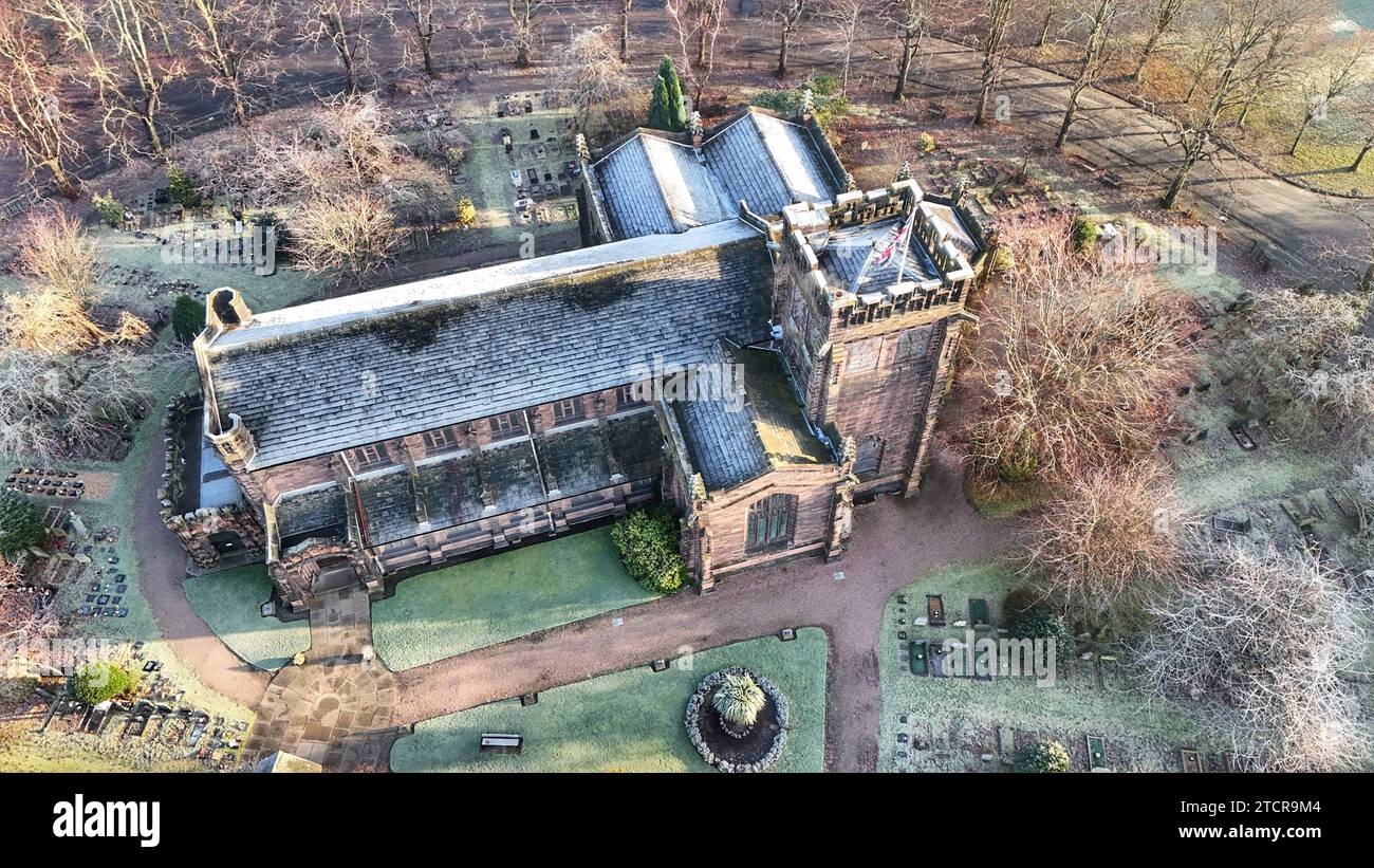 AN Aerial view of A frosty Christ Church with a clock tower and lush ...