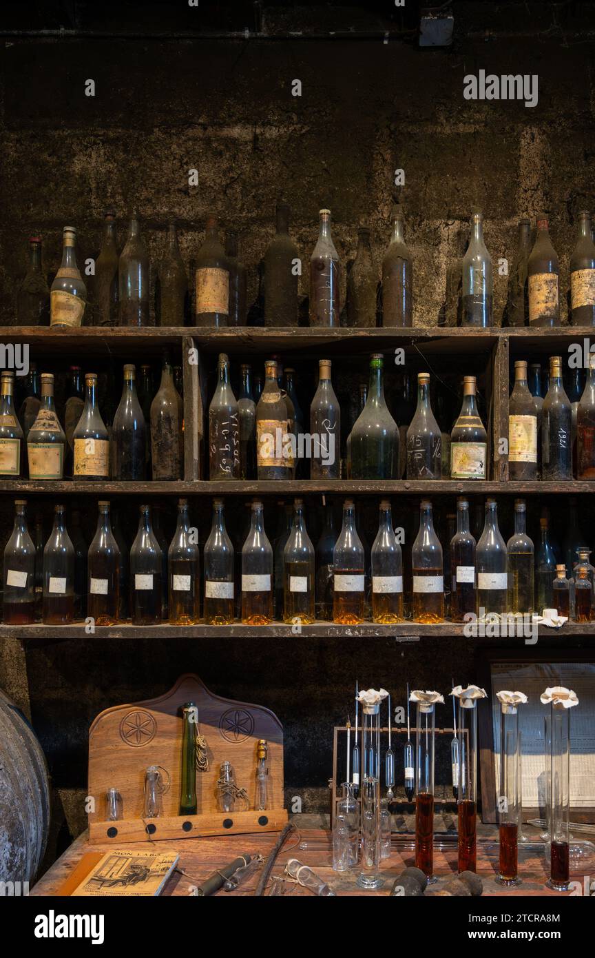 Blending process of cognac spirit and old dark French oak barrels in ...