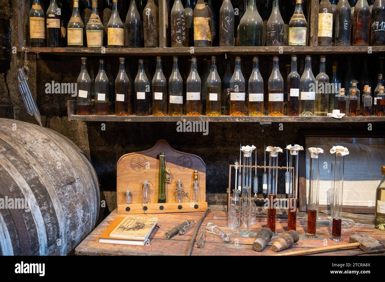 Blending process of cognac spirit and old dark French oak barrels in ...