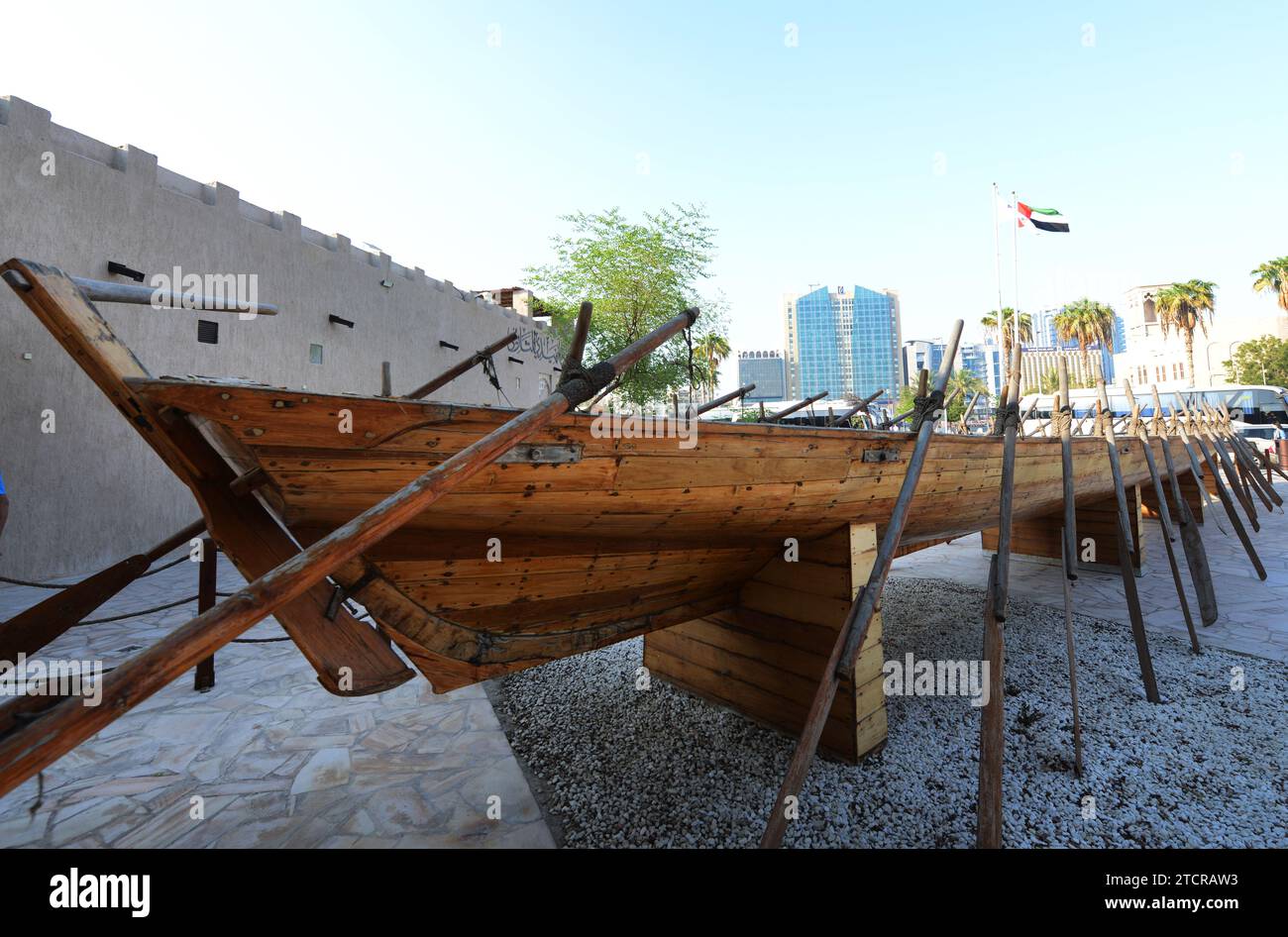 A traditional wooden rowing boat outside the fort at Al Fahidi ...
