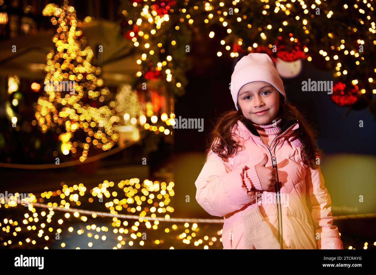 Authentic portrait of a beautiful little child girl at Christmas ...