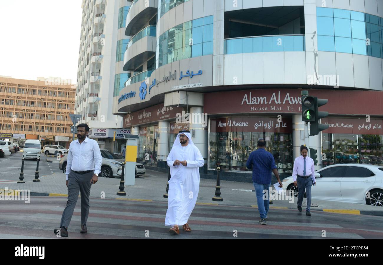 An Emirati man crossing the street in Sharjah, UAE Stock Photo - Alamy