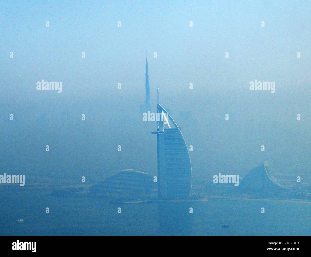 A view of Burj Al Arab and the Burj Khalifa skyscraper behind it. Dubai ...