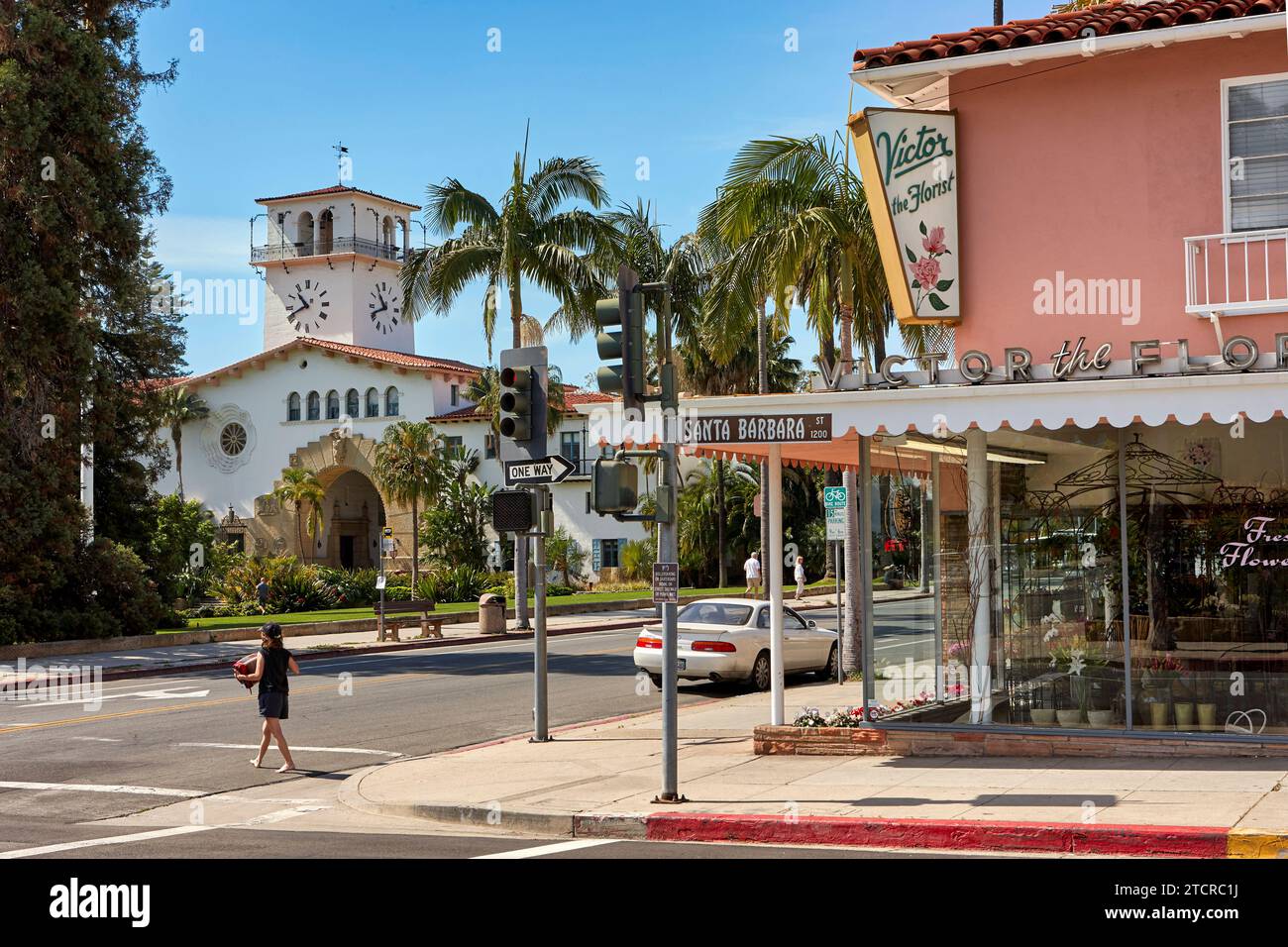 A barefooted person crosses the street in front of the Santa Barbara ...