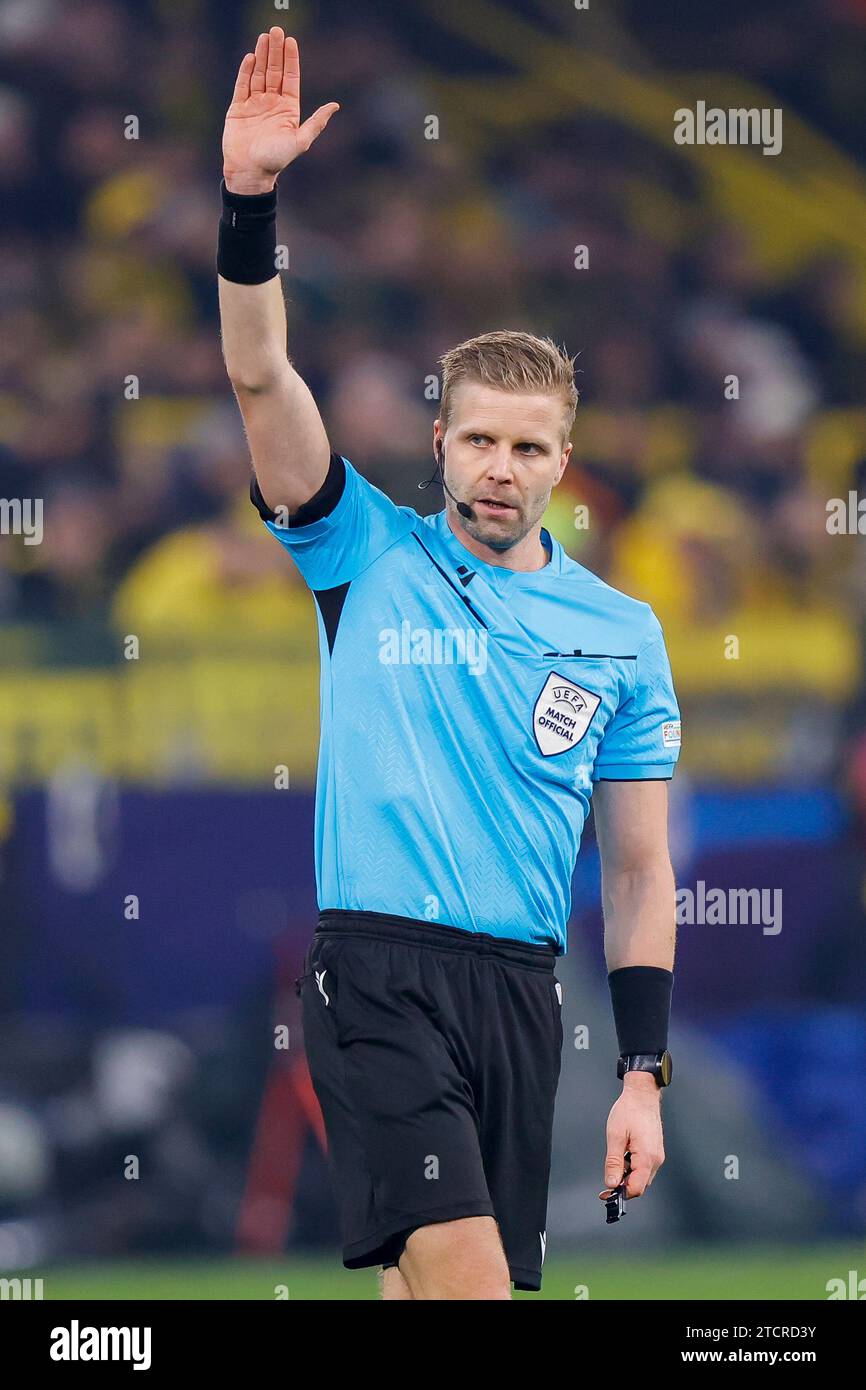 DORTMUND, GERMANY - DECEMBER 13: referee Glenn Nyberg during the UEFA ...