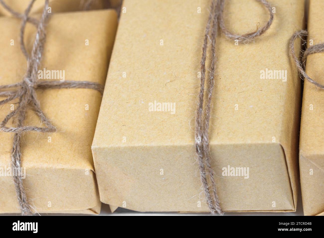 Brown gift boxes wrapped in crafted paper. Christmas holiday greeting ...