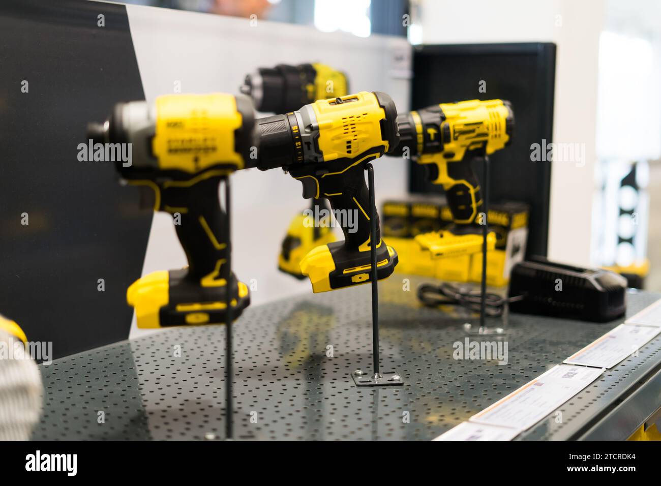 Power tools, drills and hammers of various manufacturers are sold in a ...