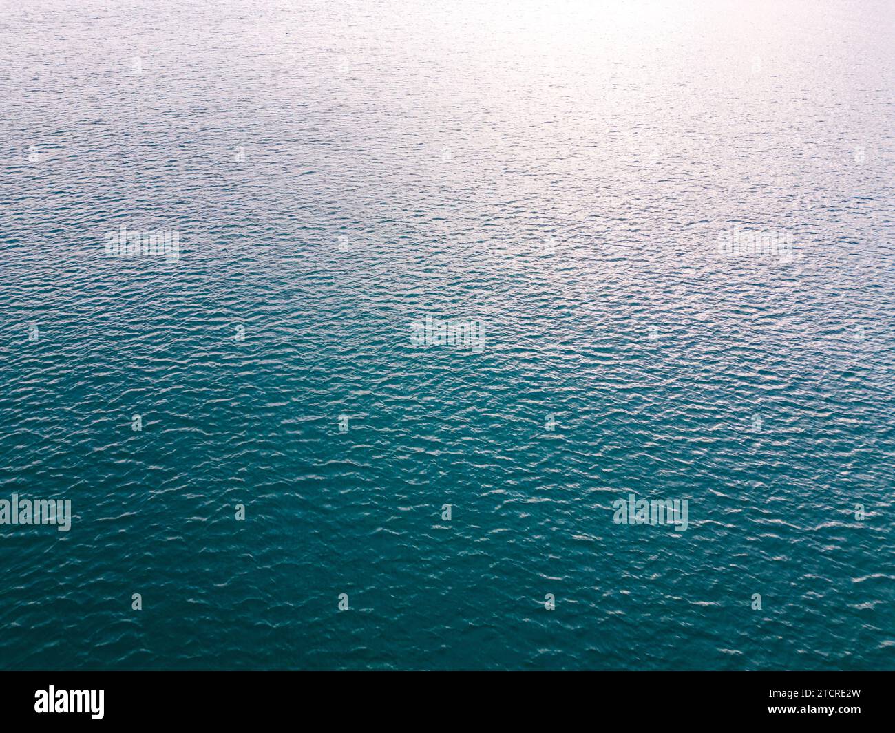 Aerial view of the sea surface pattern reflecting the sky background ...