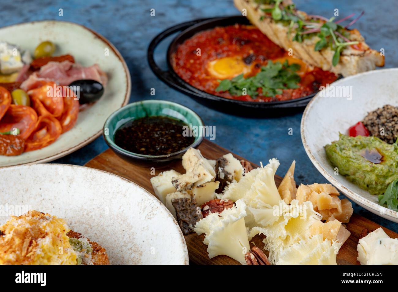 Italian cuisine. table served with plates of Italian dishes Stock Photo ...