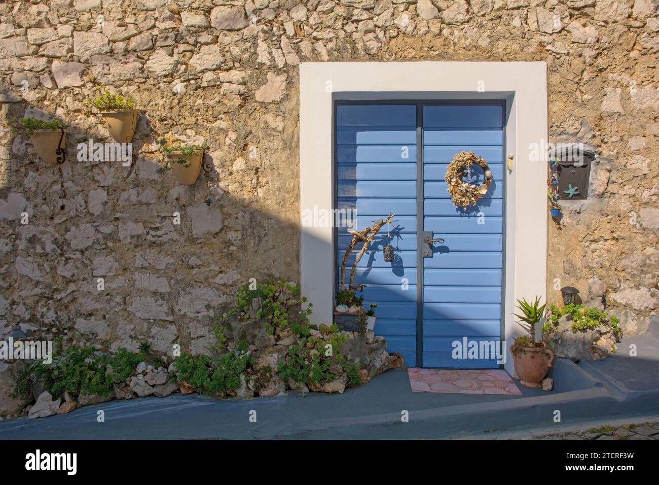 A door with plants in the Stari Grad historic centre of the coastal ...
