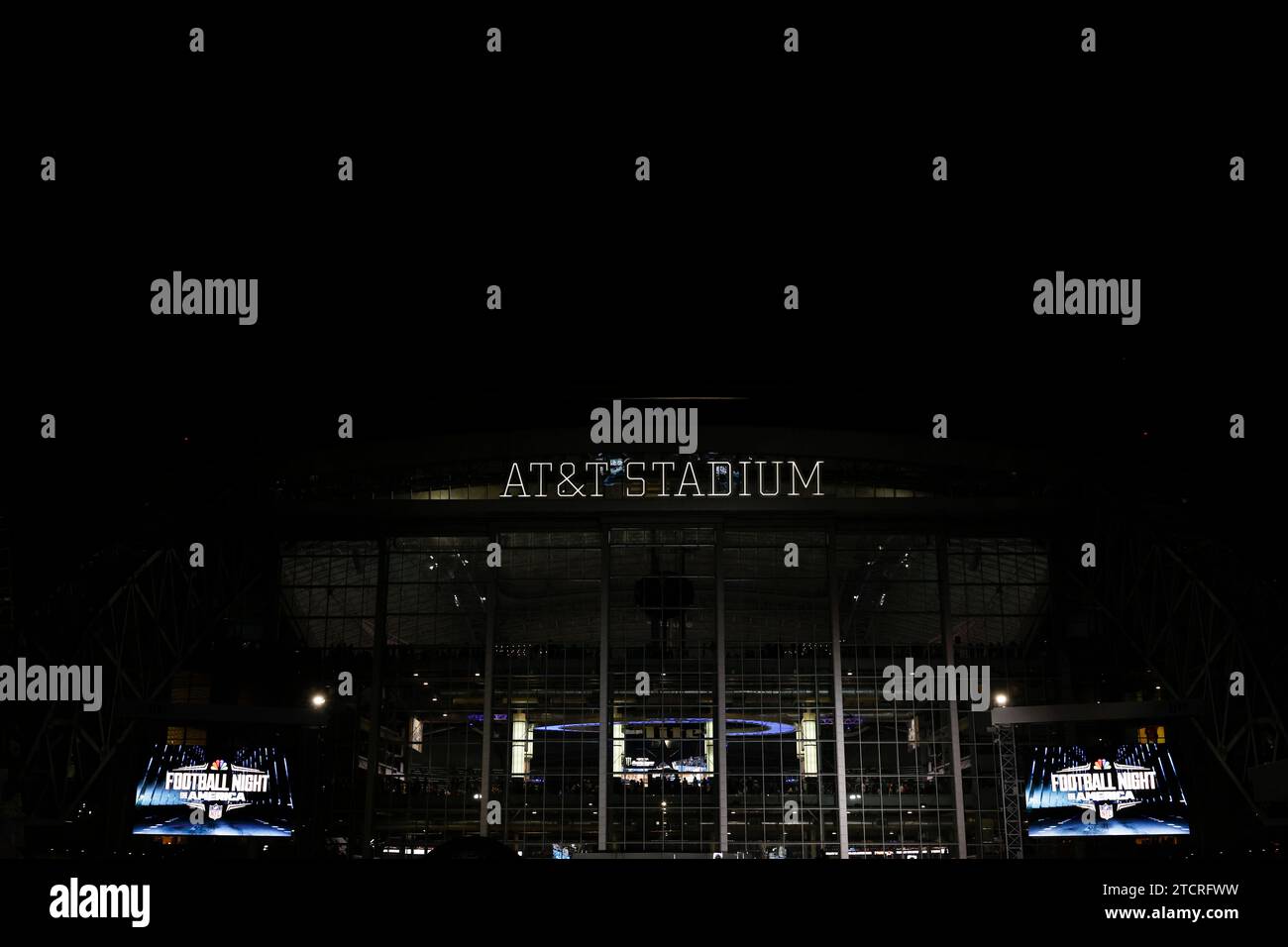 An outside view of AT&T Stadium at night with the NBC Football in ...