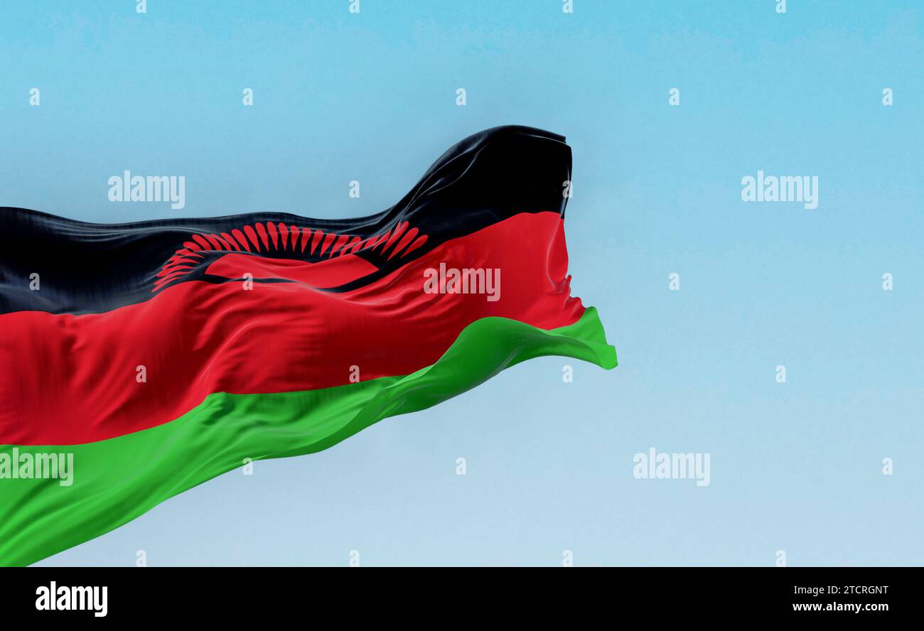 National flag of Malawi waving in the wind on a clear day. Black, red ...