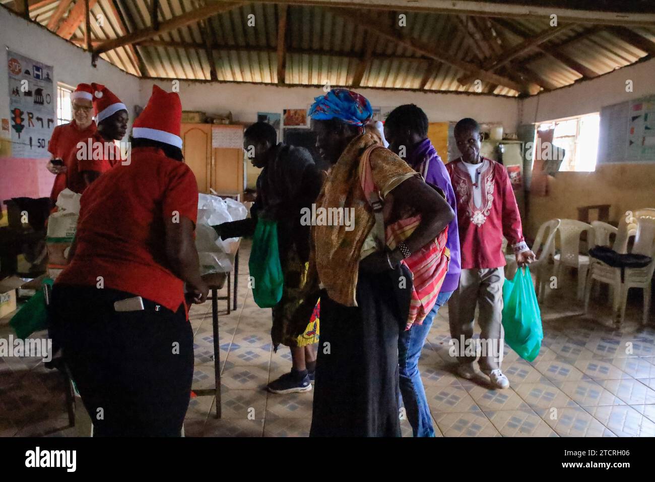 NAIROBI, Africa. 12th Dec, 2023. Women receiving Chrismas food packages ...