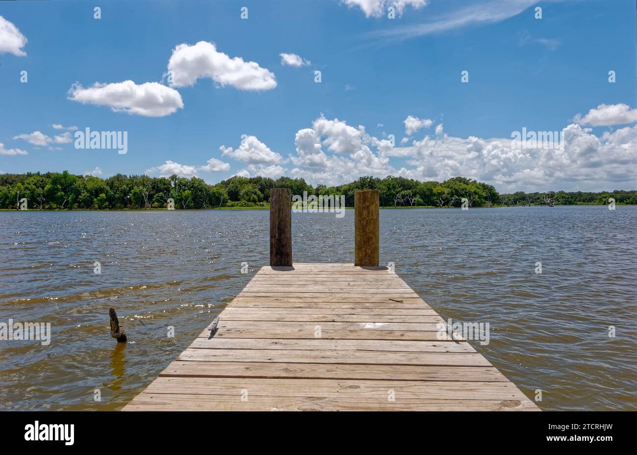Looking along a small wooden fishing jetty at the edge of Lake Texana at the Brackenridge ...