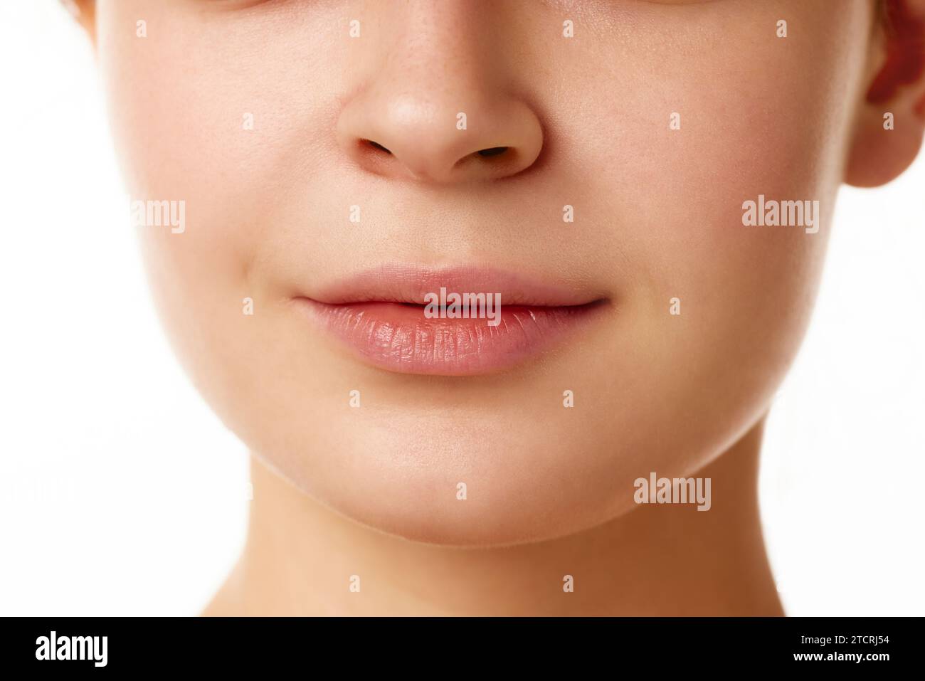 Close-up cropped image of female well-kept face, nose, lips against ...