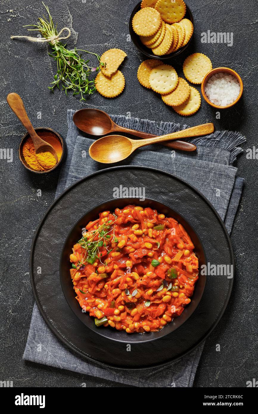 classic chakalaka, refreshing spicy tomato bean relish in black bowl on ...