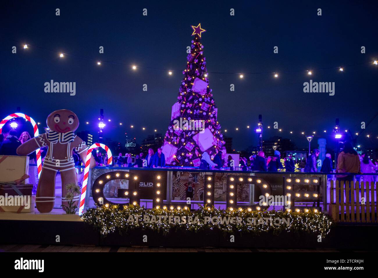 London, UK. 13th Dec, 2023. Gingerbread man stands with candy canes by ...