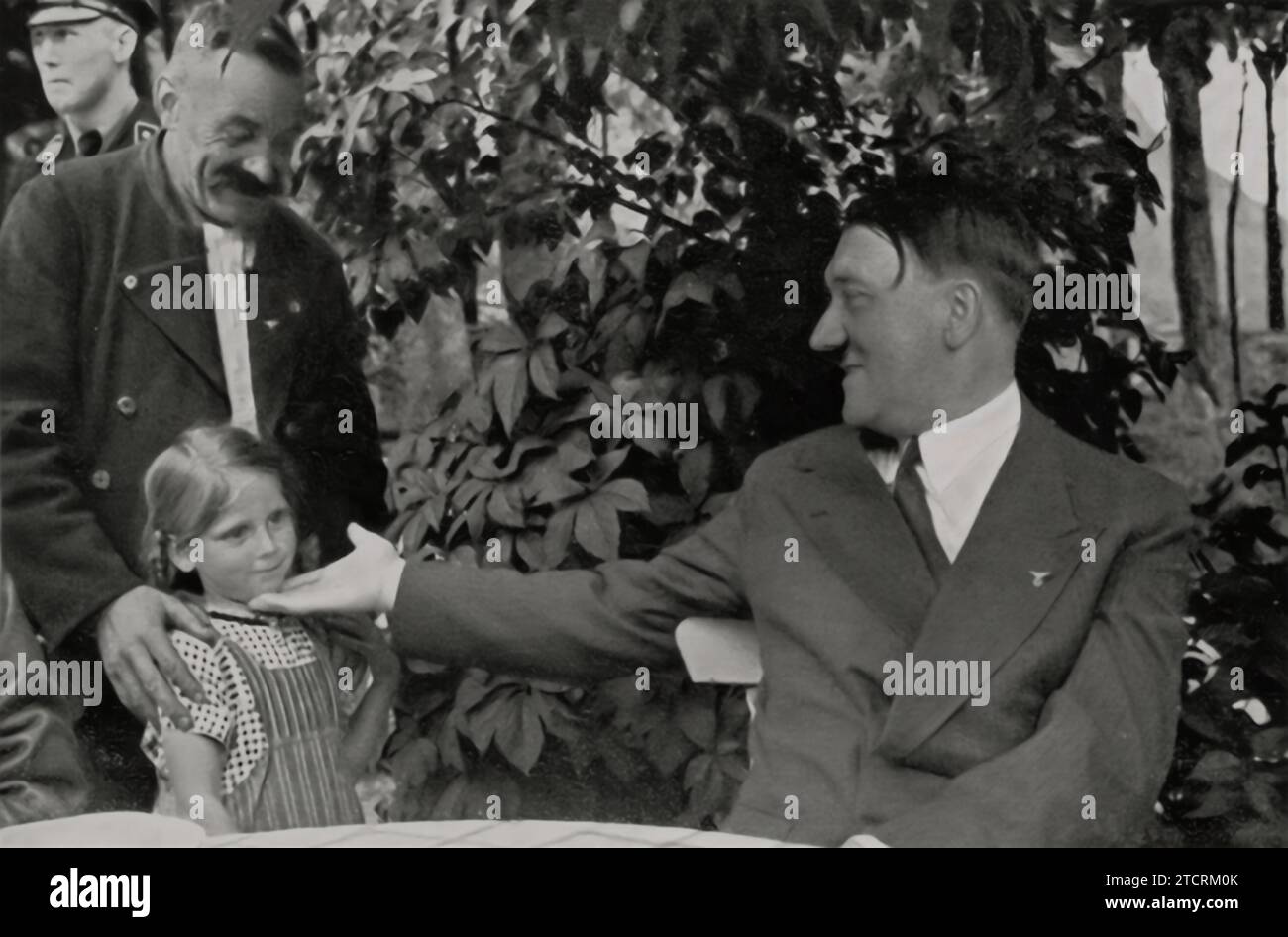 In a staged portrayal, an older individual introduces their grandchild ...