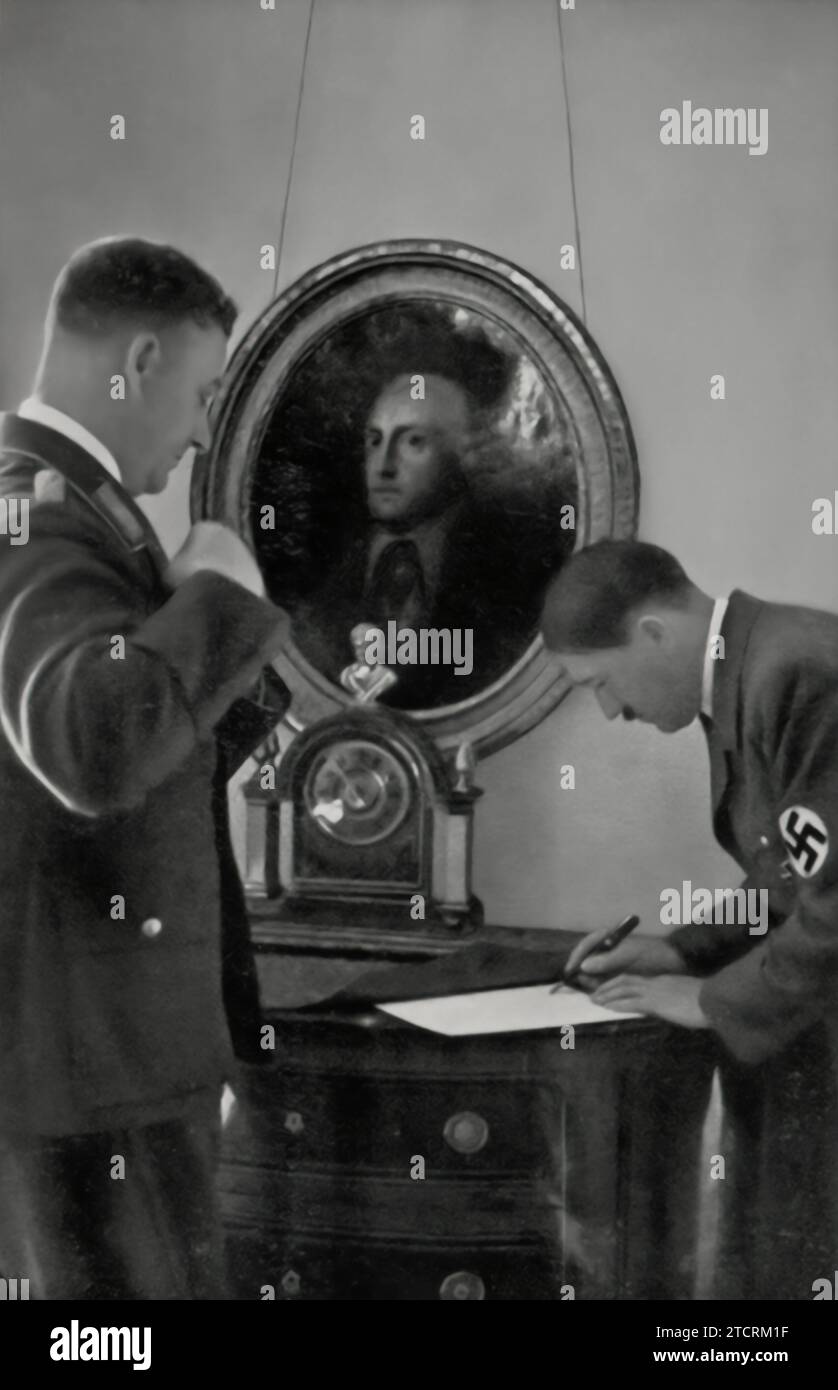 In the Reich Chancellery, Adolf Hitler is seen with his Chief of Staff ...