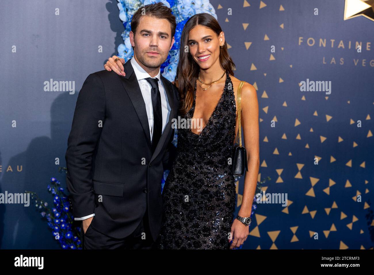 Paul Wesley (L) and Natalie Kuckenburg attend the grand opening of ...