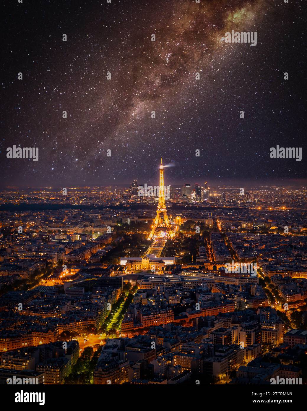 The Eiffel Tower at night under the Milky Way galaxy in Paris, France ...