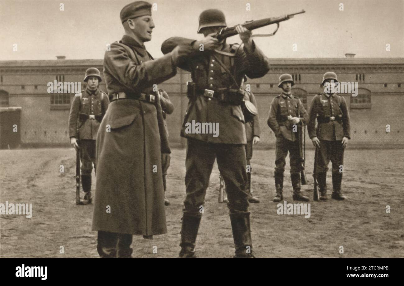 A German army recruit is depicted undergoing rifle training, with his ...