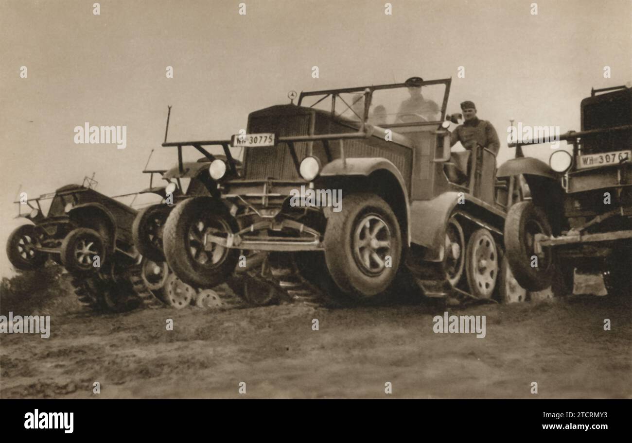 German soldiers are captured navigating a hill in heavy offroad trucks ...