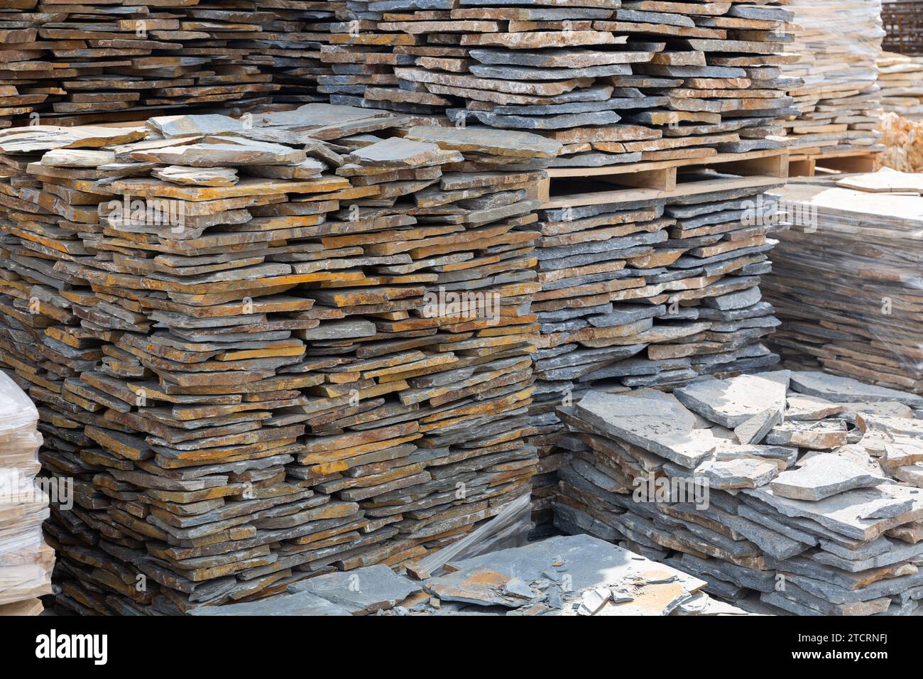 Natural stone blocks packed in stacks at a hardware store warehouse ...
