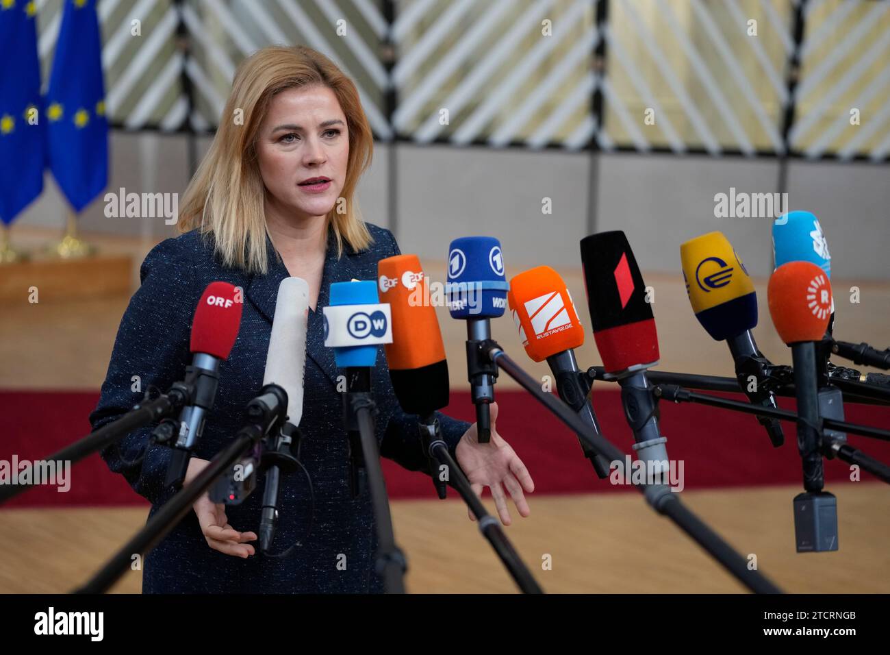 Latvia's Prime Minister Evika Silina speaks with the media as she arrives for an EU summit at ...