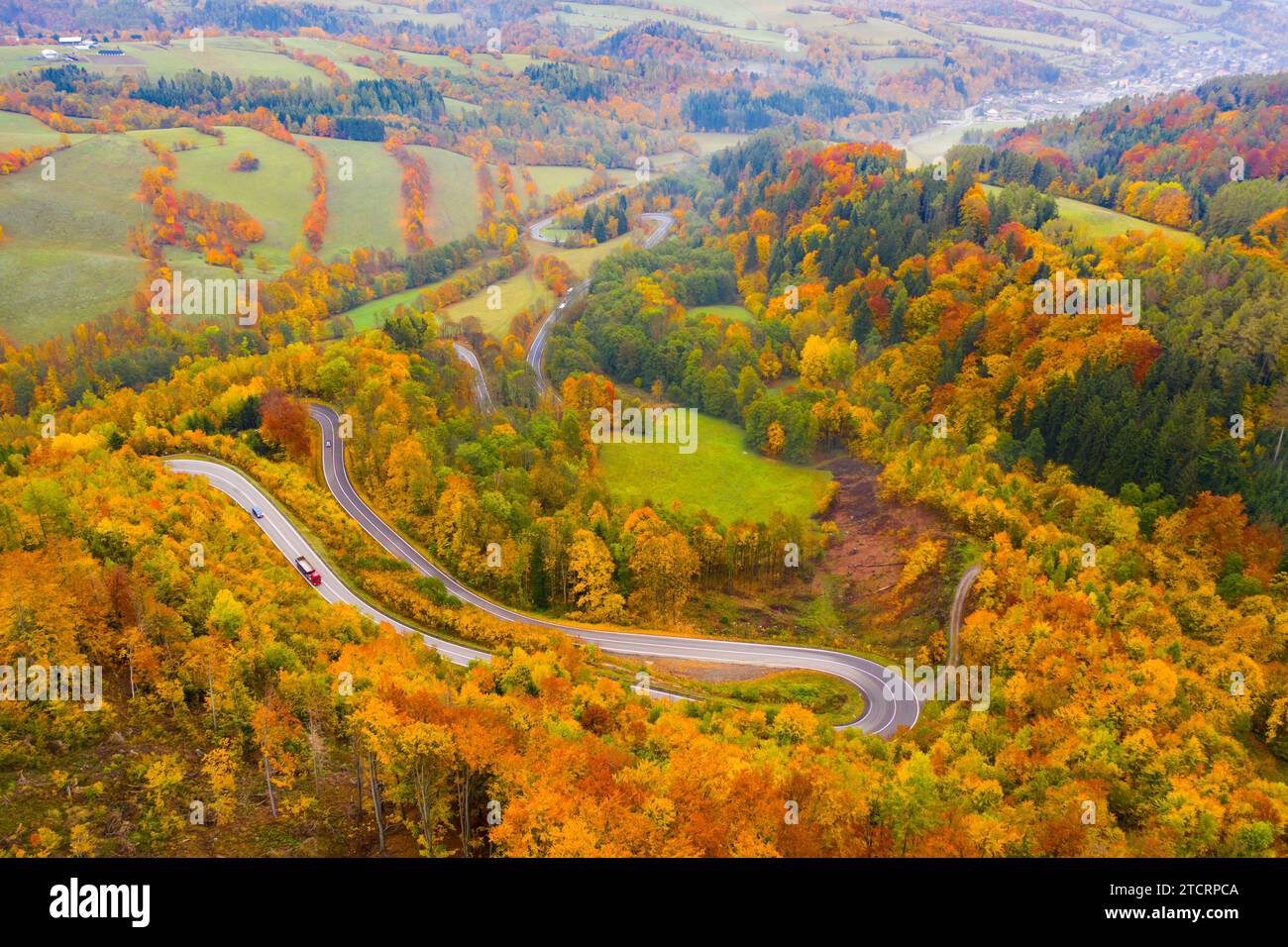 Autumn landscape with winding road Stock Photo - Alamy