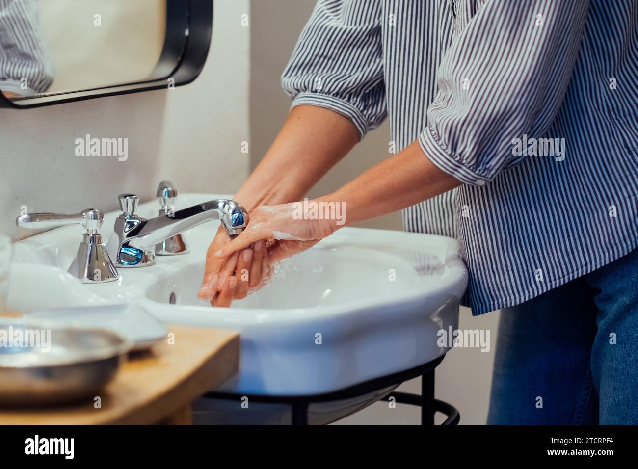 Retro hand washing at sink hi-res stock photography and images - Alamy