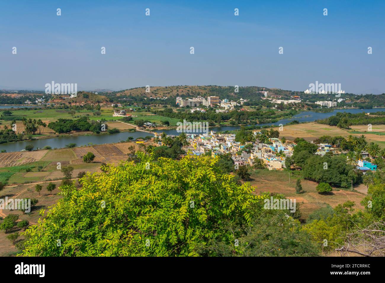 Landscape from Puttaparthi with the lake green trees,buildings, temple ...