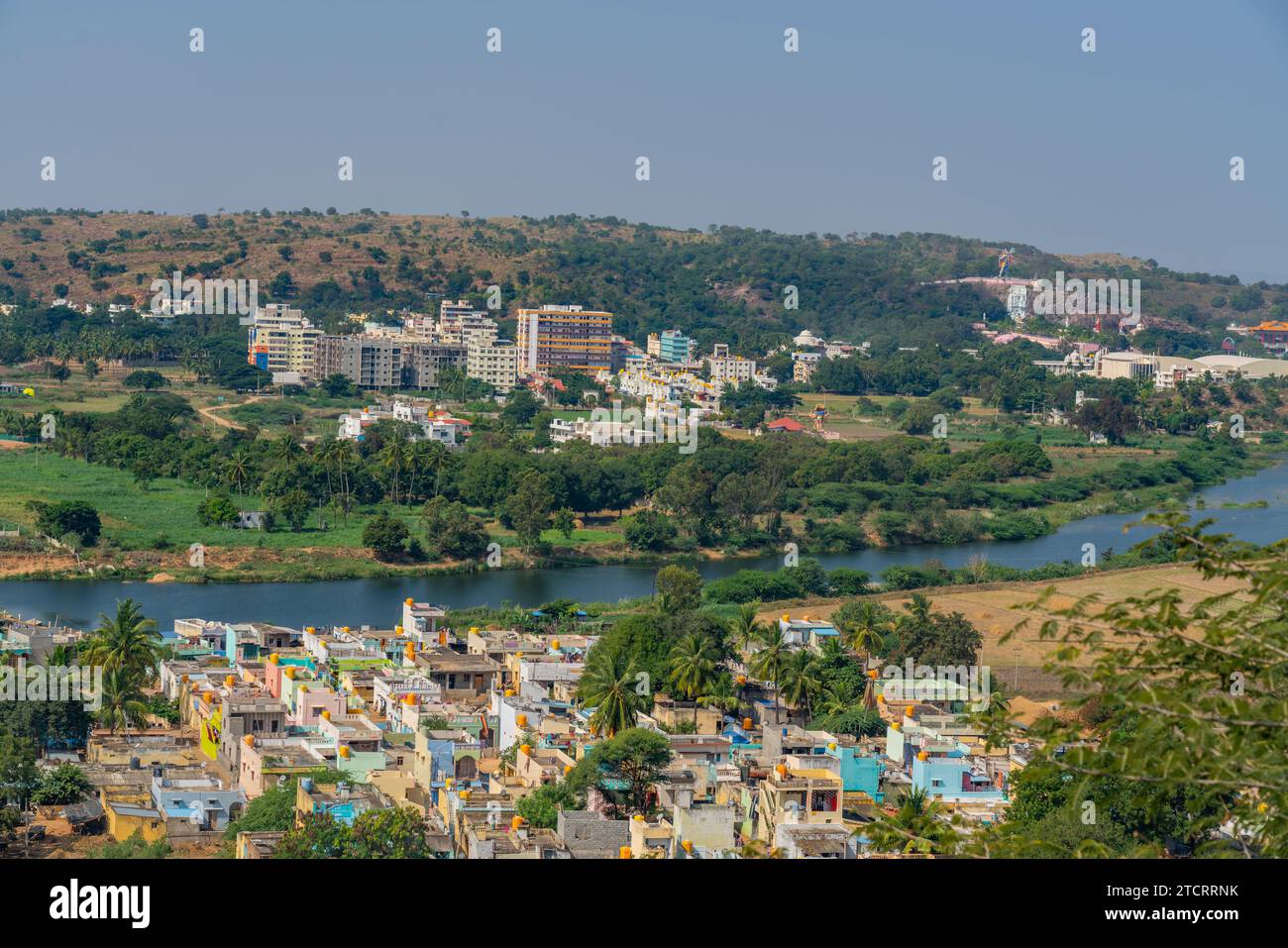 Landscape from Puttaparthi with the lake green trees,buildings, temple ...