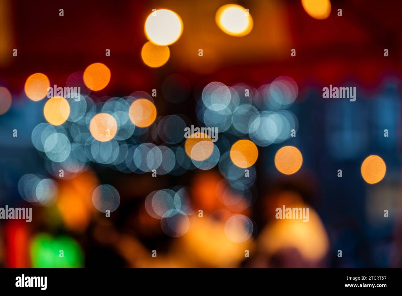 A Christmas bokeh background featuring a vibrant array of festive ...
