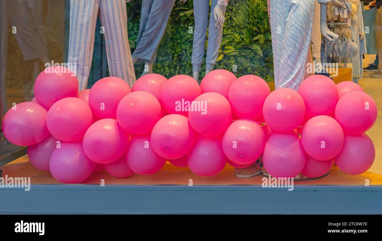 Cluster of Pink Latex Balloons Store Window Decoration Stock Photo - Alamy