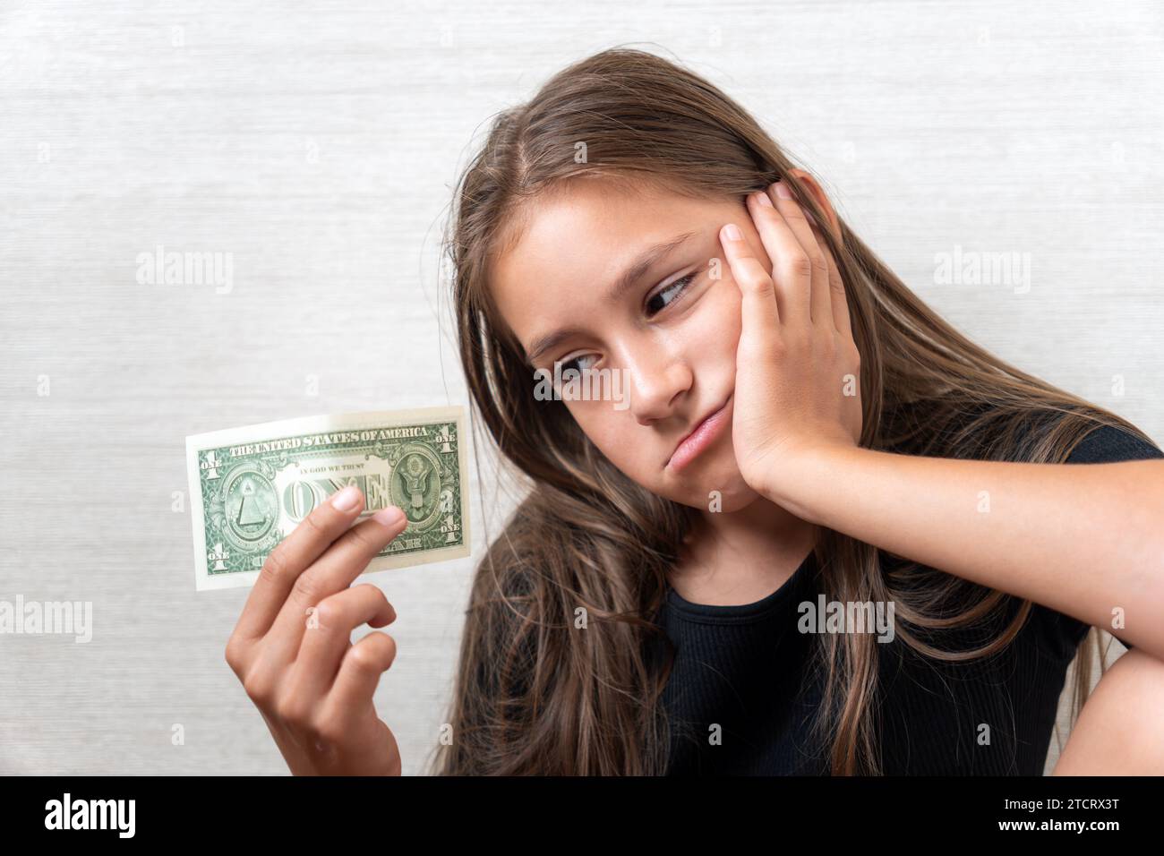 Sad child with money dollar. Not enough money. white background Stock ...