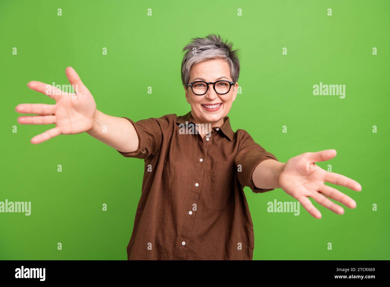 Photo of friendly positive woman with short hairstyle wear brown shirt ...