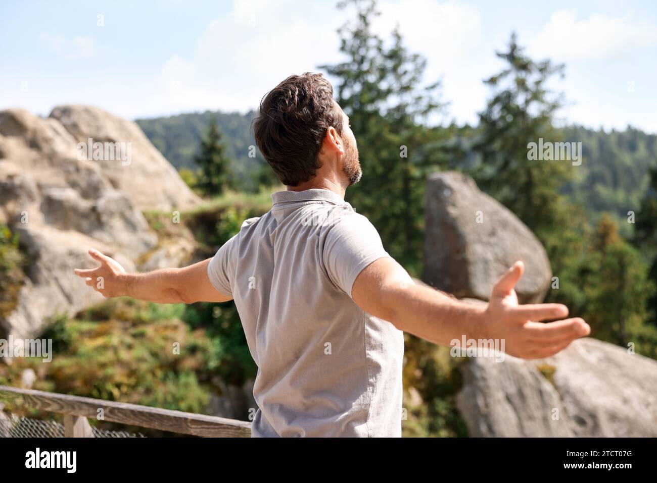 Feeling freedom. Man with wide open arms in mountains Stock Photo - Alamy